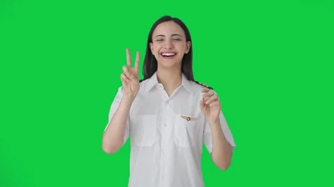 Happy Indian woman pilot showing victory... | Stock Video | Pond5