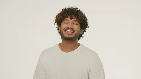Happy Indian young man laughing at camer... | Stock Video | Pond5