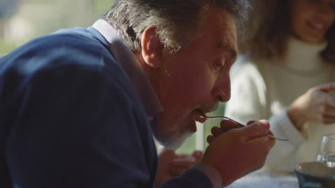 Happy Italian man eating a plate of past... | Stock Video | Pond5