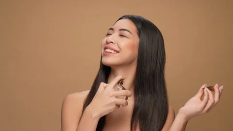 Happy japanese lady use perfume spray sh... | Stock Video | Pond5