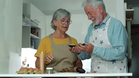 Happy joyful older husband and wife shar... | Stock Video | Pond5