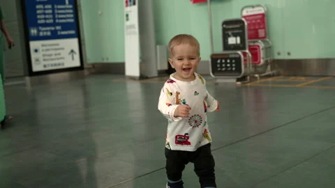 Happy kid running at camera indoor of ai... | Stock Video | Pond5