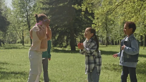 Happy Kids Playing Blind Mans Buff Outdo... | Stock Video | Pond5
