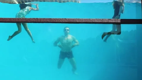 happy kids swimming underwater in pool w... | Stock Video | Pond5