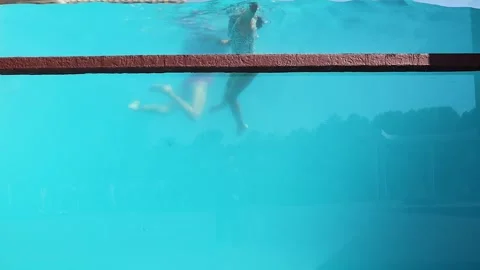 happy kids swimming underwater in pool w... | Stock Video | Pond5