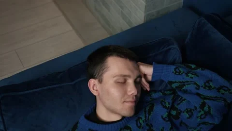 Happy lazy young man relax daydream on c... | Stock Video | Pond5