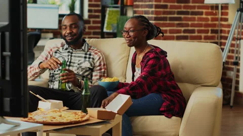 Happy life partners binge watching tv sh... | Stock Video | Pond5