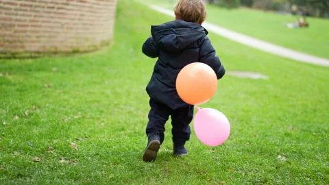 Happy little baby boy running outside ho... | Stock Video | Pond5