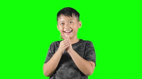 Happy little boy clapping hands on studi... | Stock Video | Pond5