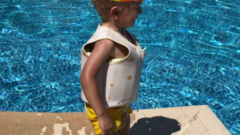 Happy little boy in life jacket for kids... | Stock Video | Pond5