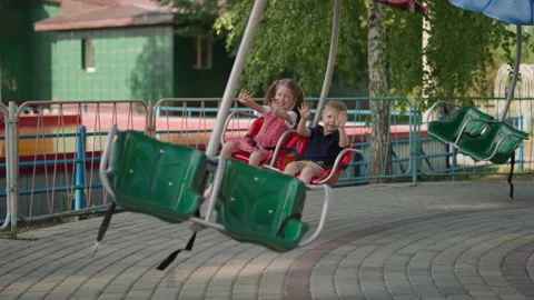 Happy little children wave hands riding ... | Stock Video | Pond5
