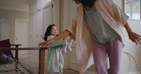 happy little girl chasing mother and dau... | Stock Video | Pond5