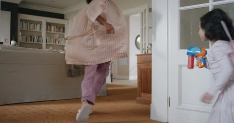 happy little girl chasing mother and dau... | Stock Video | Pond5