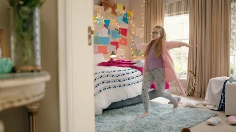 happy little girl dancing in bedroom pra... | Stock Video | Pond5