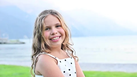 Happy little girl exudes emotions of joy... | Stock Video | Pond5