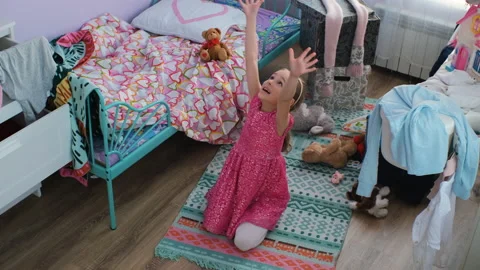 Happy little girl making a mess in her r... | Stock Video | Pond5