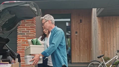Happy married couple moving out from hom... | Stock Video | Pond5