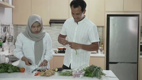 happy muslim couple cooking together in ... | Stock Video | Pond5