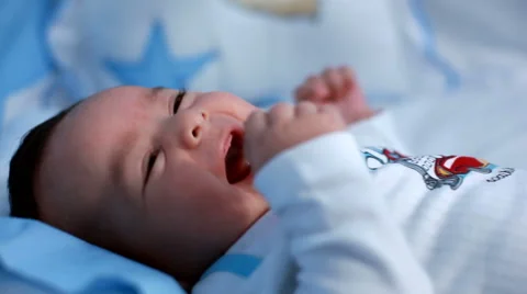 Happy newborn baby laughing close-up in ... | Stock Video | Pond5