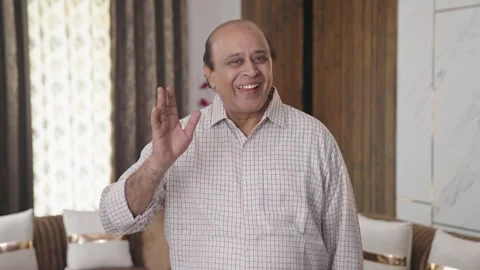 Happy old Indian uncle waving Hi to the ... | Stock Video | Pond5