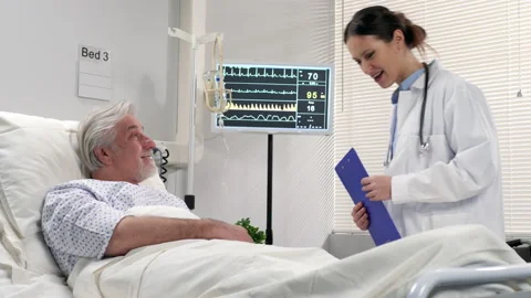 happy old patient in hospital bed talkin... | Stock Video | Pond5