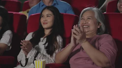 Happy people applauding sitting on seats... | Stock Video | Pond5