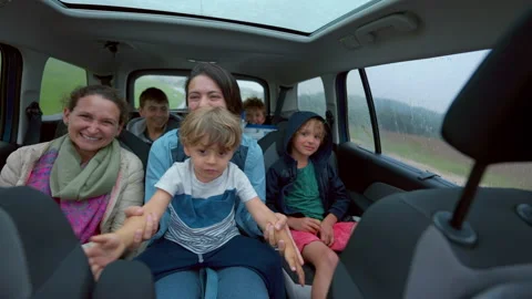 Happy people inside car backseat waving ... | Stock Video | Pond5