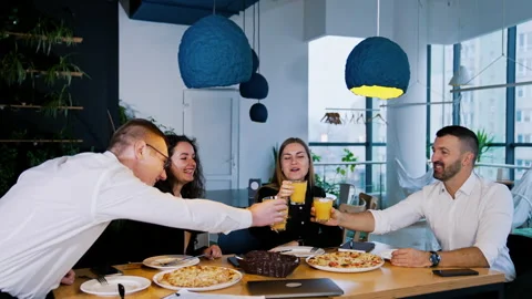 Happy people sitting at the dinner table... | Stock Video | Pond5