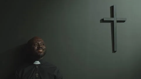 Happy Priest in Cassock Standing in Mode... | Stock Video | Pond5