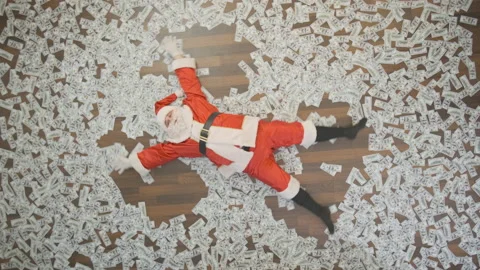 Happy Santa Claus lies in sea of money a... | Stock Video | Pond5
