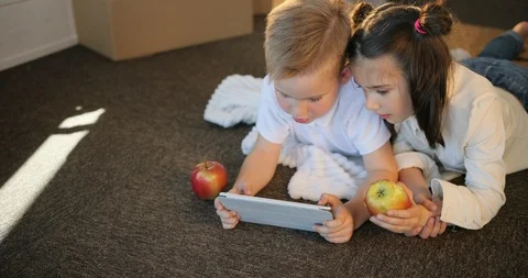 Happy siblings child using pc tablet tog... | Stock Video | Pond5