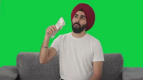 Happy Sikh Indian man using money as fan... | Stock Video | Pond5