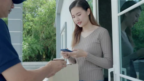 Happy smile Asian woman scan QR code for... | Stock Video | Pond5