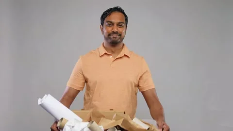 happy smiling indian man sorting paper w... | Stock Video | Pond5