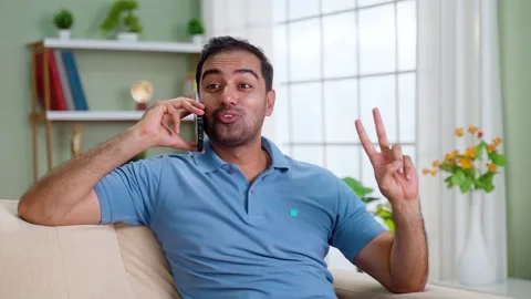 Happy smiling indian man talking on mobi... | Stock Video | Pond5