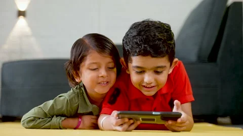 Happy smiling kids using mobile phone wh... | Stock Video | Pond5