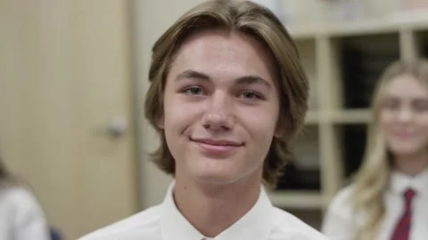 Happy student teen boy smiles at camera ... | Stock Video | Pond5