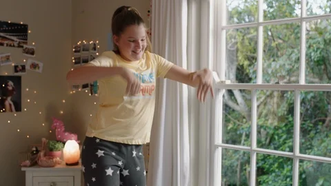 happy teenage girl dancing in bedroom ha... | Stock Video | Pond5