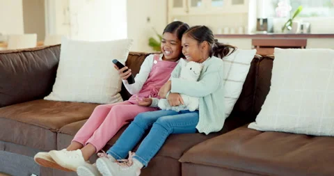 Happy, TV and children on sofa with remo... | Stock Video | Pond5