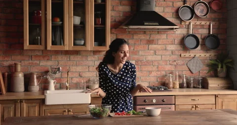 Happy woman dancing singing while cookin... | Stock Video | Pond5