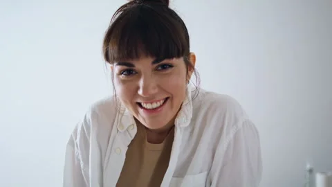 Happy woman winking camera at home portr... | Stock Video | Pond5