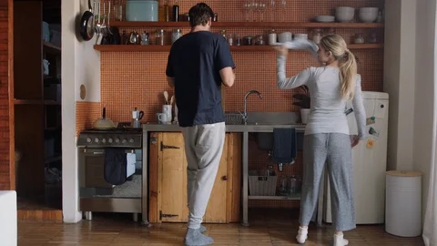 happy young couple dancing in kitchen en... | Stock Video | Pond5