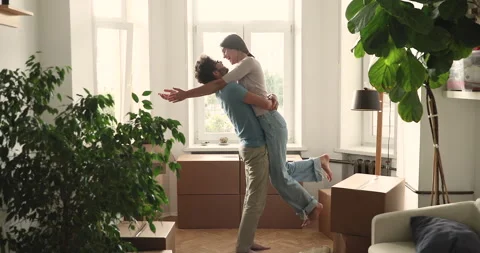 Happy young couple hug celebrate relocat... | Stock Video | Pond5