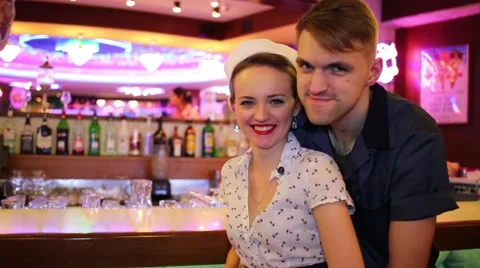 Happy young couple sit at bar counter in... | Stock Video | Pond5