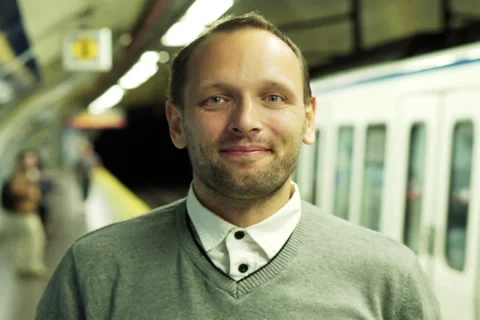 Happy young man standing on metro statio... | Stock Video | Pond5