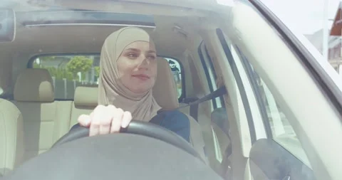 Happy young rabian woman in hijab is dri... | Stock Video | Pond5