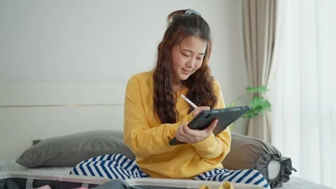 Happy young woman check list on tablet j... | Stock Video | Pond5