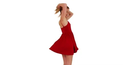 Happy young woman in fun red dress danci... | Stock Video | Pond5
