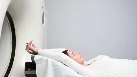 Happy young woman is undergoing a CT sca... | Stock Video | Pond5