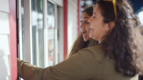 Happy Young Women Get Cold Drinks From F... | Stock Video | Pond5